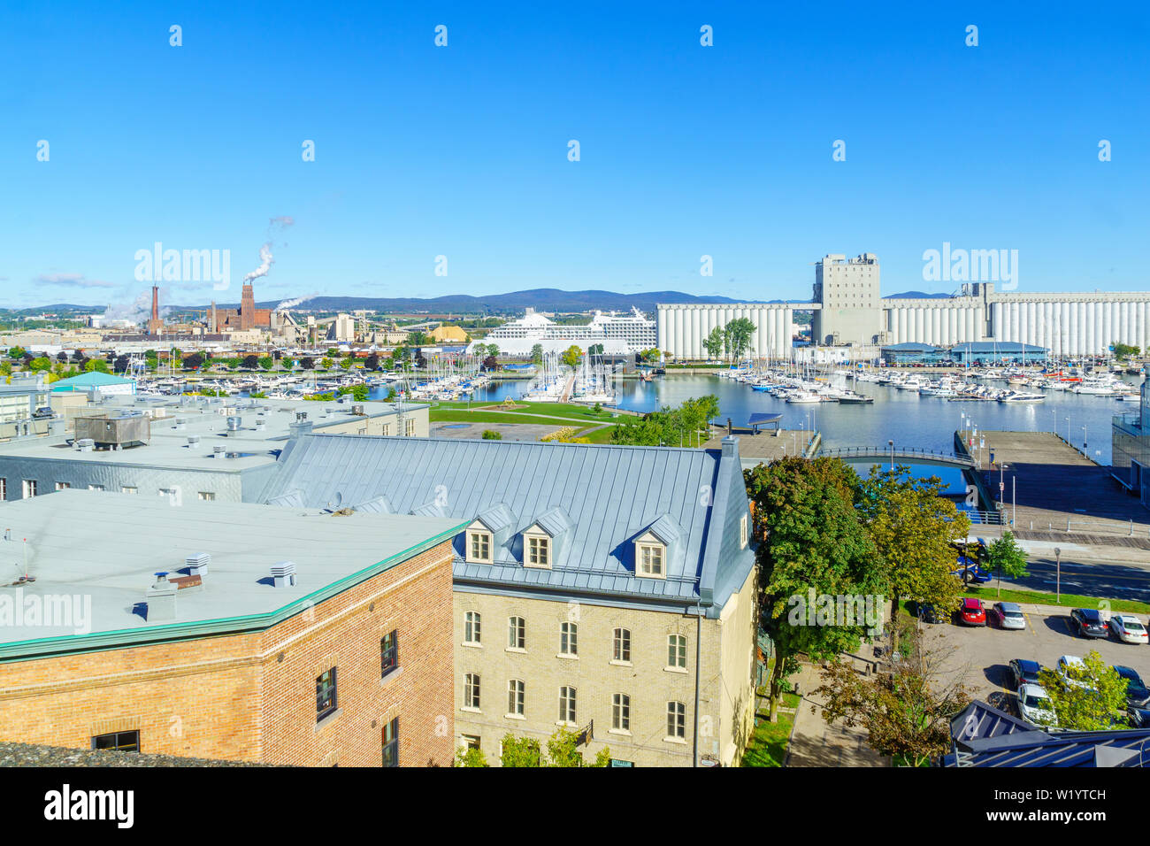 View of the old port area, with locals and visitors, in Quebec City ...