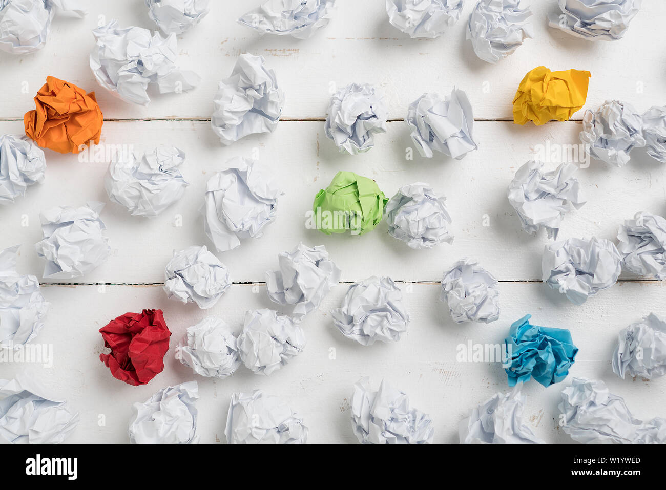 crumpled paper symbolizing different solutions with some standing out ...