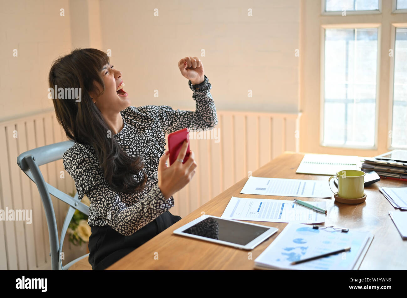 Secretary happy moment on office workplace Stock Photo - Alamy