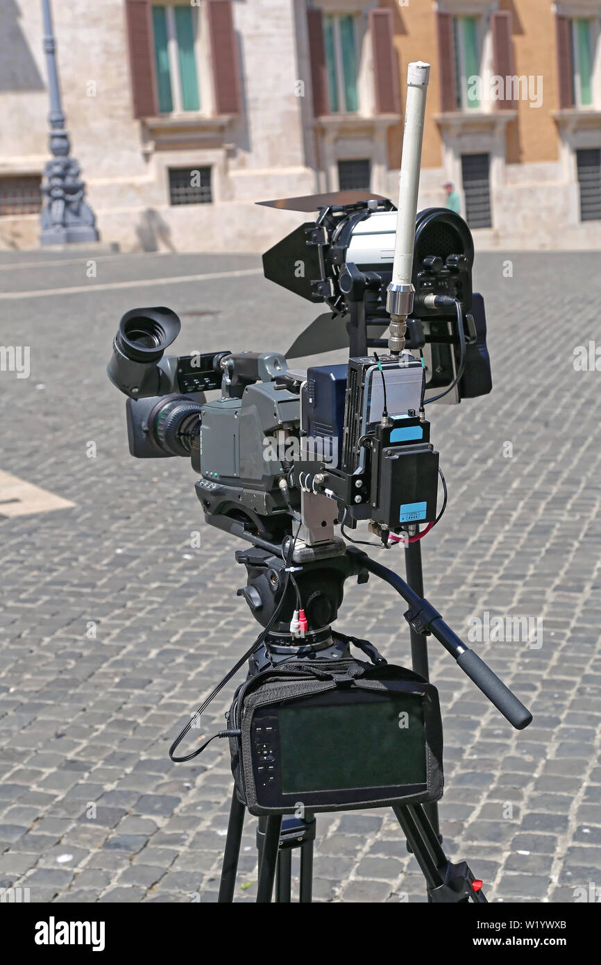 TV News Camera With Portable Link and Light Stock Photo - Alamy
