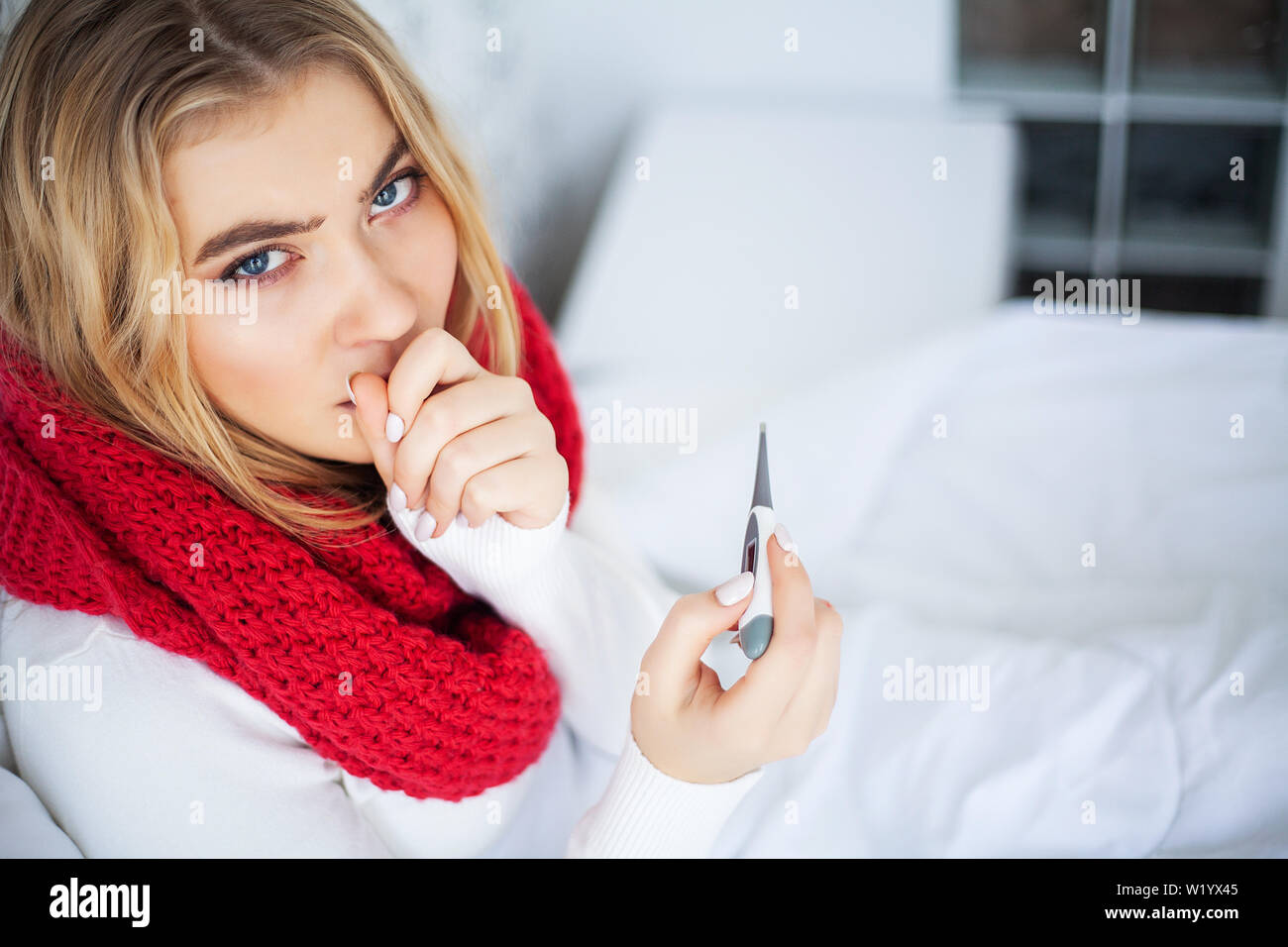 Sick woman with flu. Woman Suffering From Cold Lying In Bed With Tissue ...
