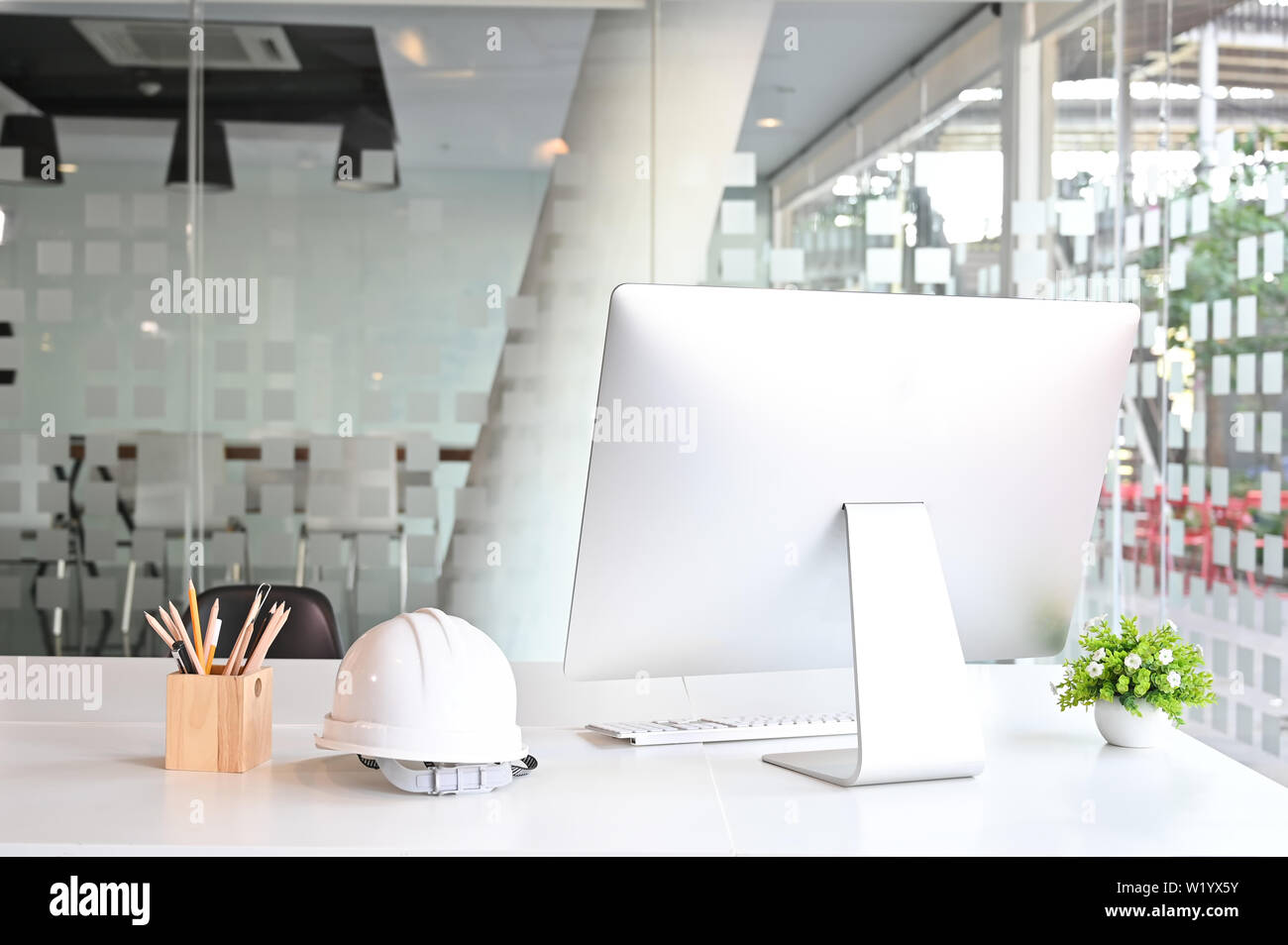 Workspace with computer, safety helmet and pencil on office desk Stock ...