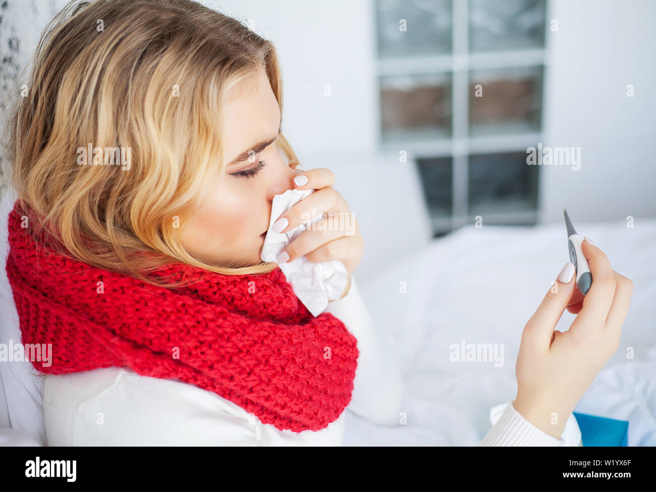 Sick woman with flu. Woman Suffering From Cold Lying In Bed With Tissue ...
