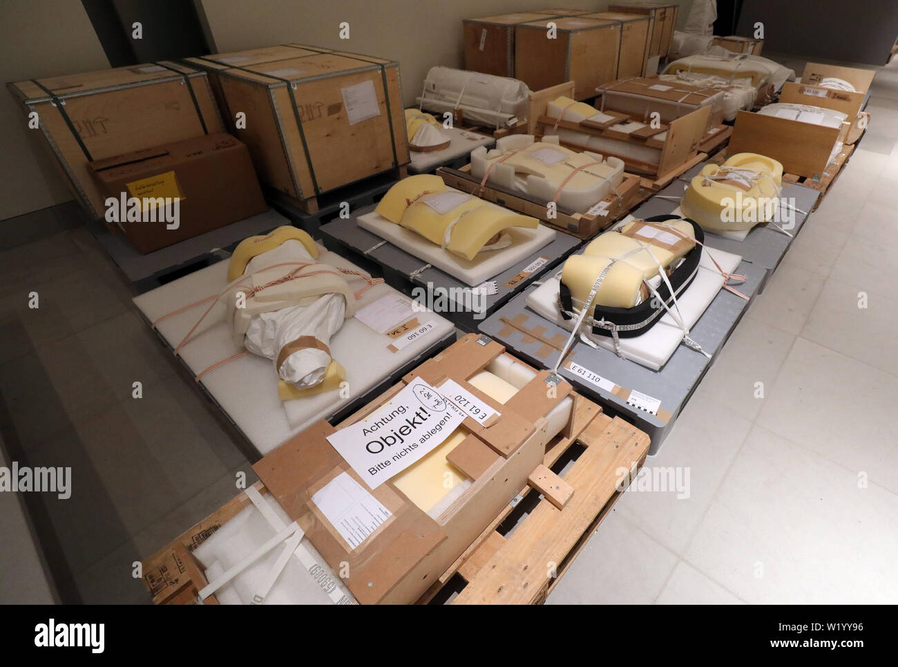 04 July 2019, Berlin: Packed art objects lie on pallets during a tour ...