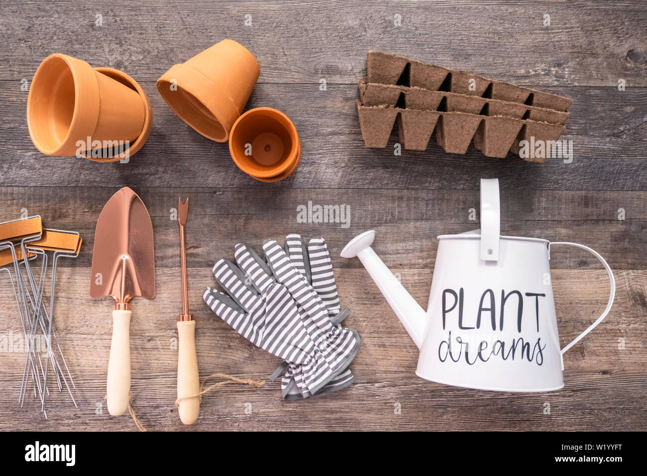 Flat lay. Small garden tools are ready for Spring planting season ...