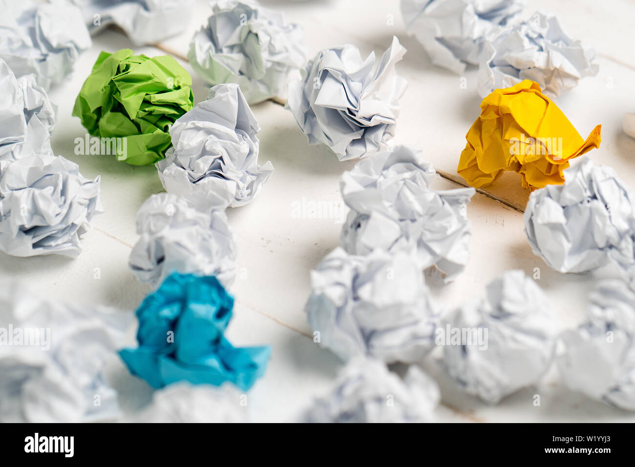 crumpled paper symbolizing different solutions with some standing out ...