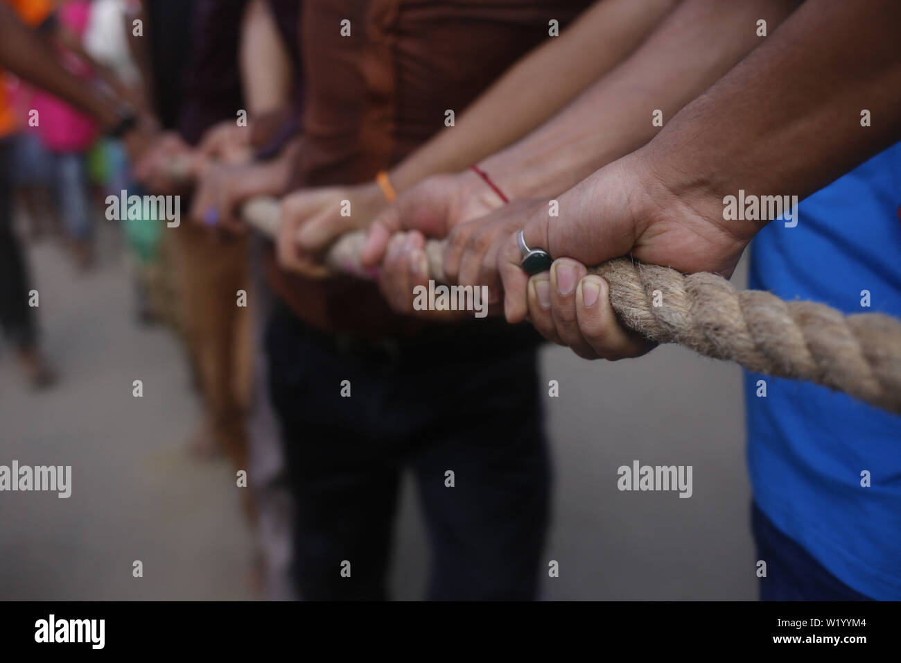 Dhaka, bangladesh. 4th July, 2019. Hindu devotees hold a rope as they ...