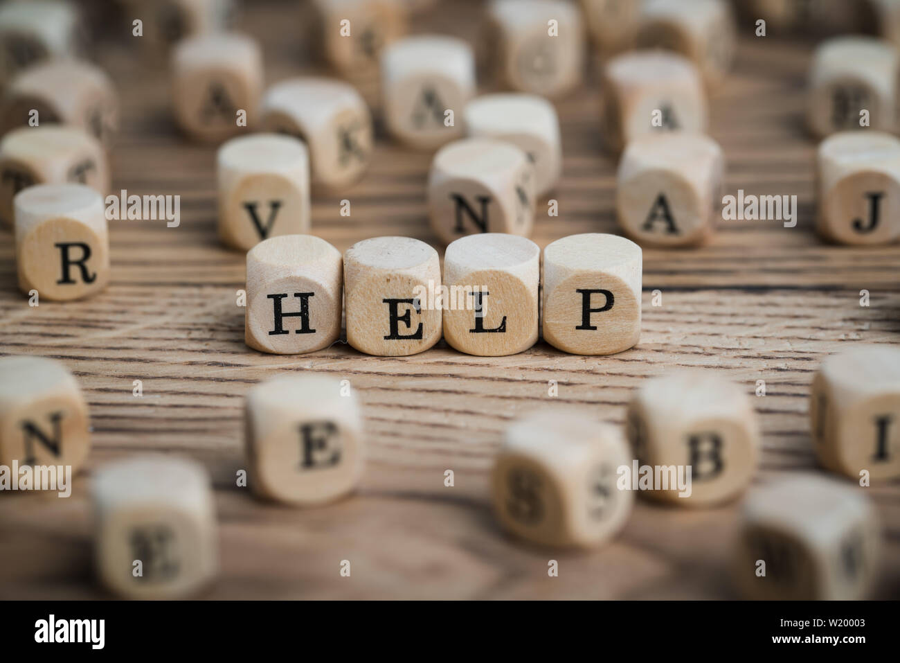 dice forming the word HELP Stock Photo - Alamy