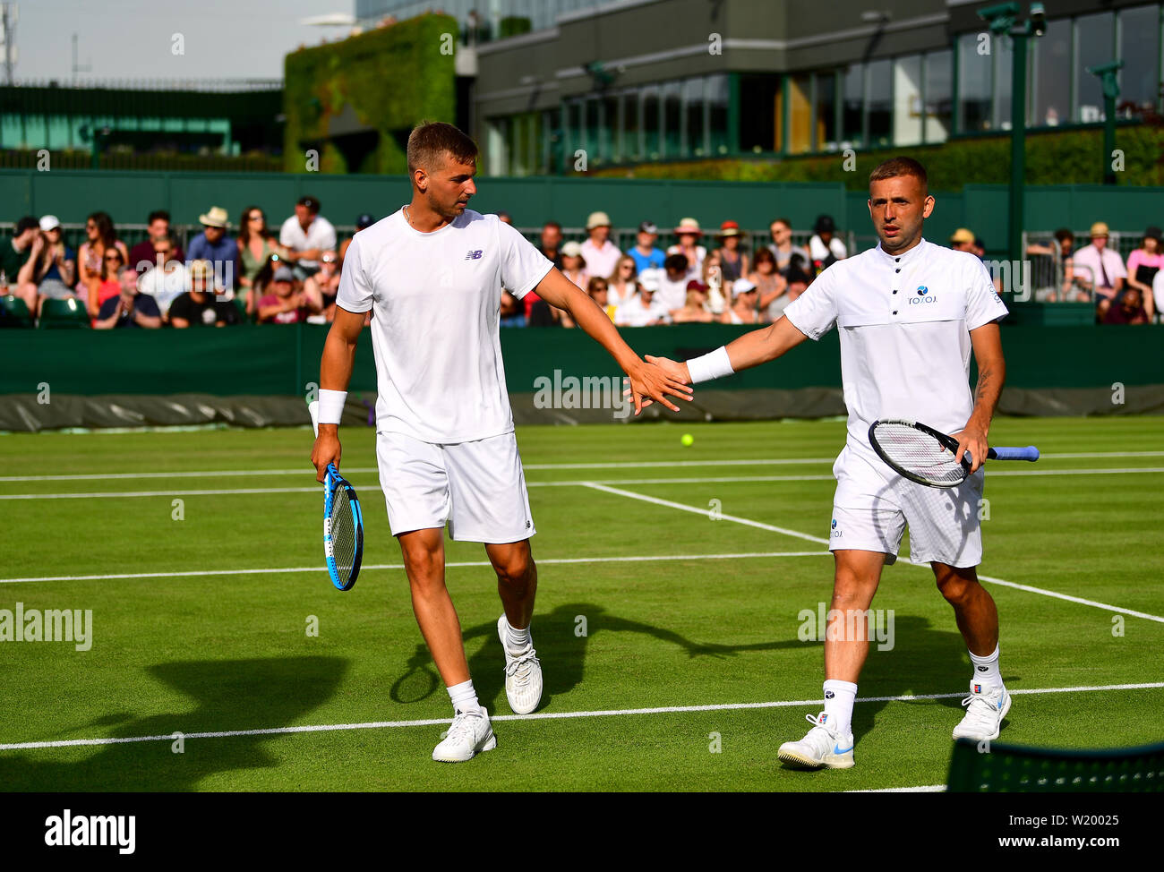 Dan Evans and Lloyd Glasspool during their doubles match on day four of ...