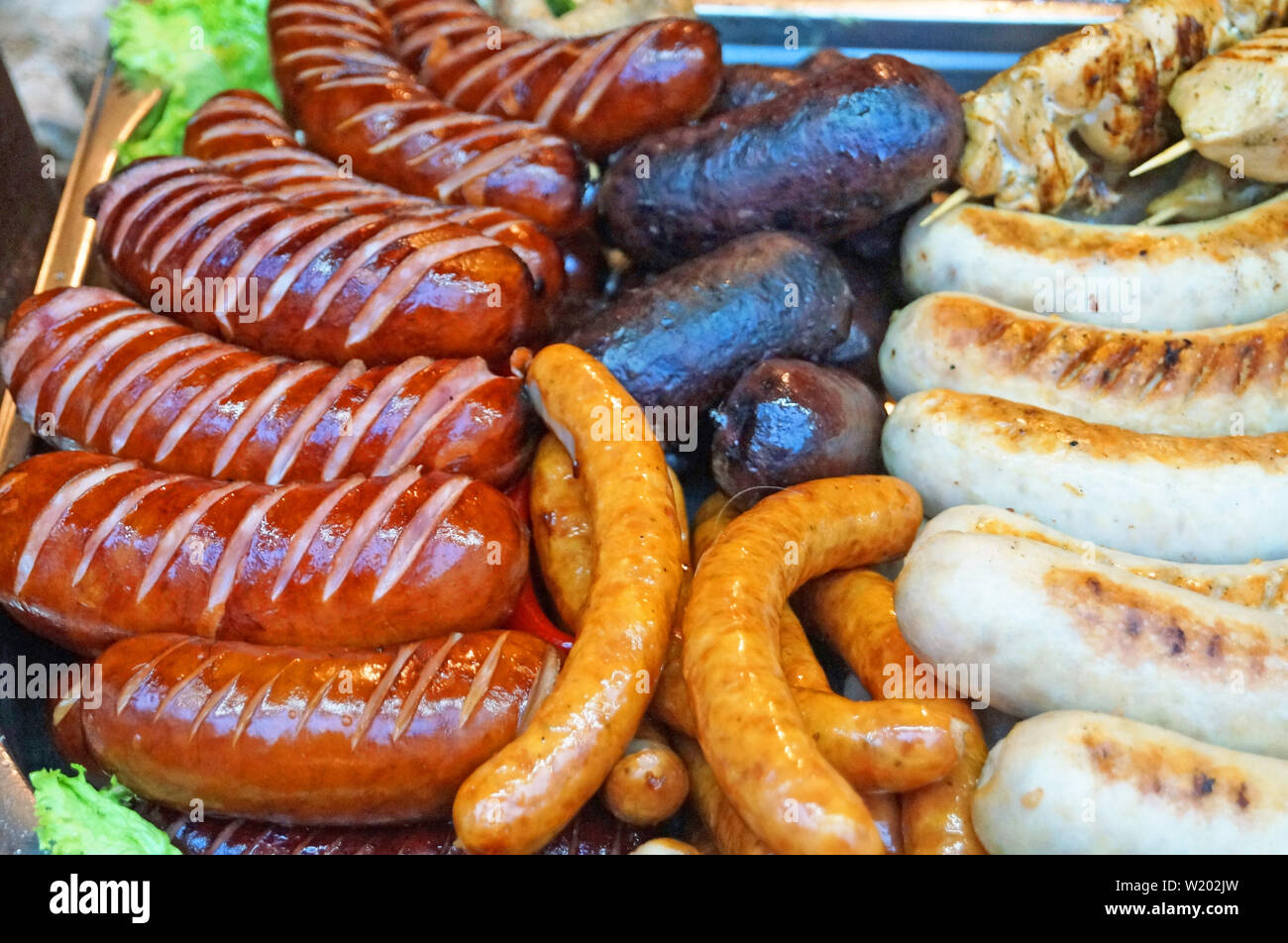 Grilled sausages, homemade sausages and kupaty on the counter at the ...