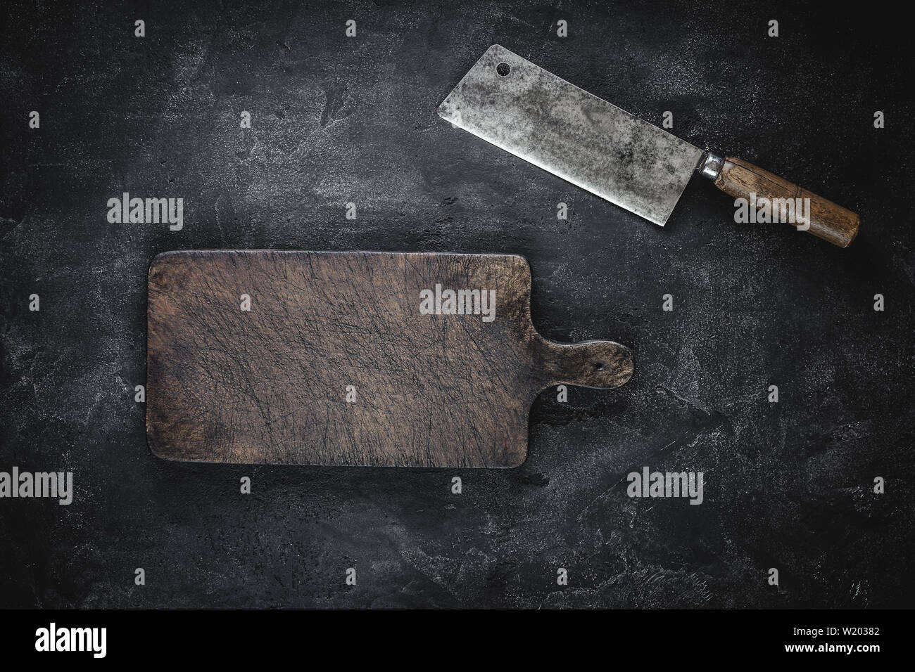 Rustic Cutting Board and Meat Cleaver on Dark Background. Butcher Shop ...