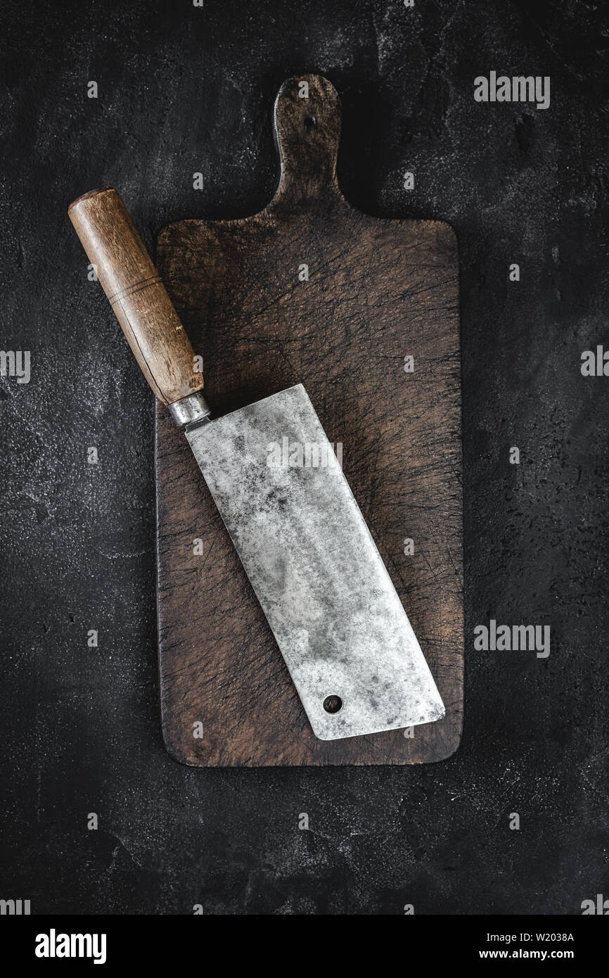 Rustic Cutting Board and Meat Cleaver on Dark Background. Butcher Shop ...