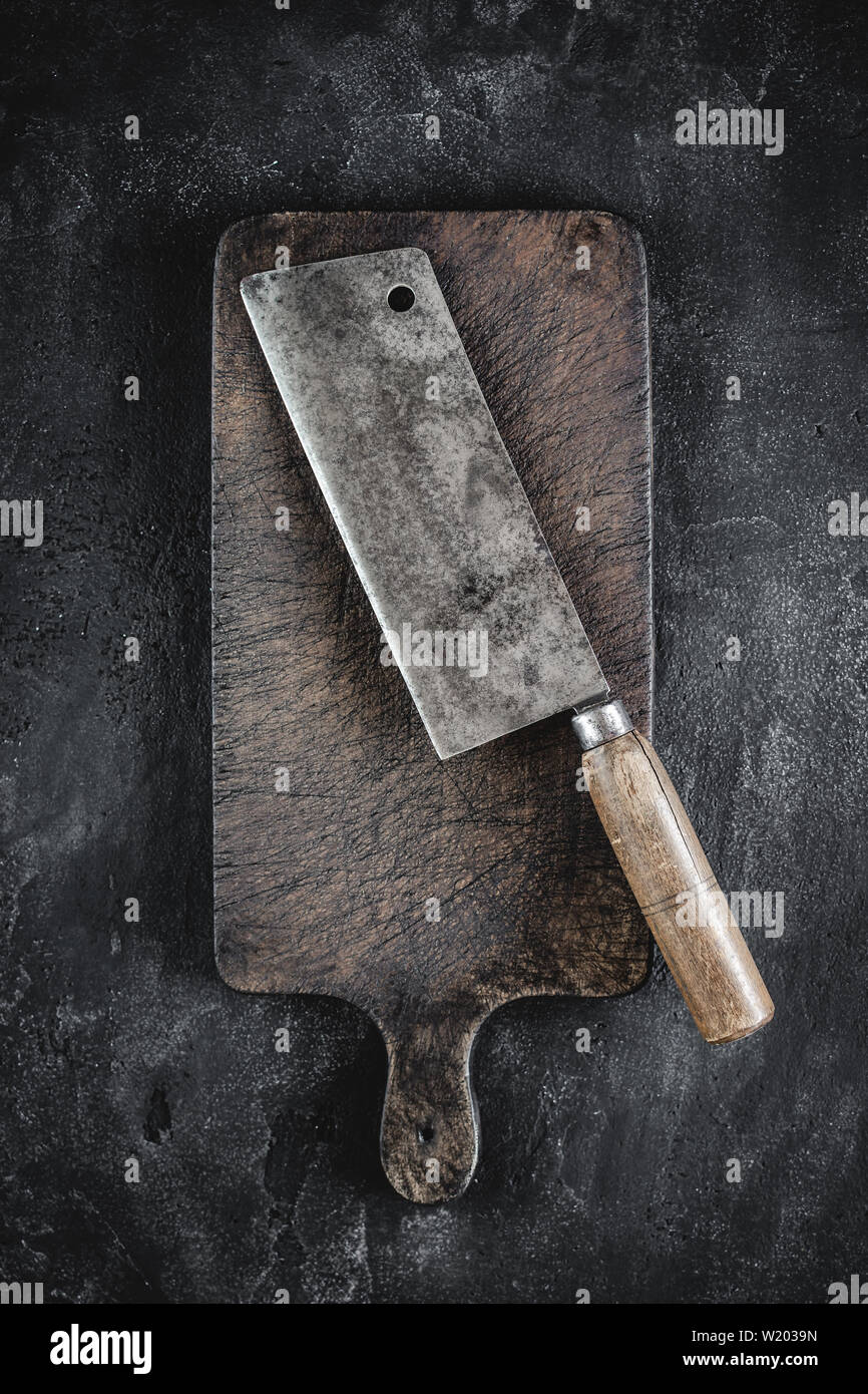 Rustic Cutting Board and Meat Cleaver on Dark Background. Butcher Shop ...