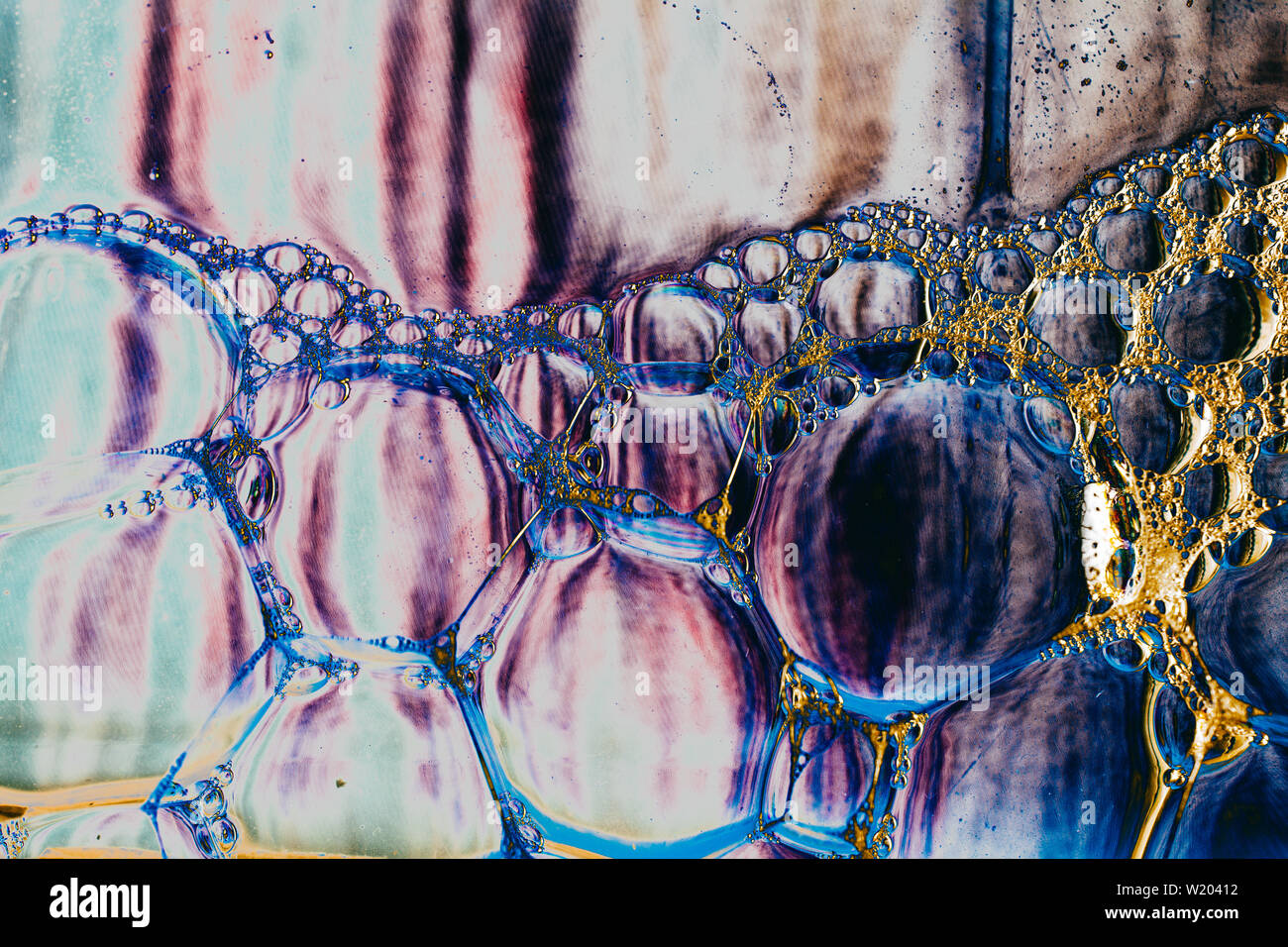 Oil bubbles inside water base form patterns Stock Photo - Alamy
