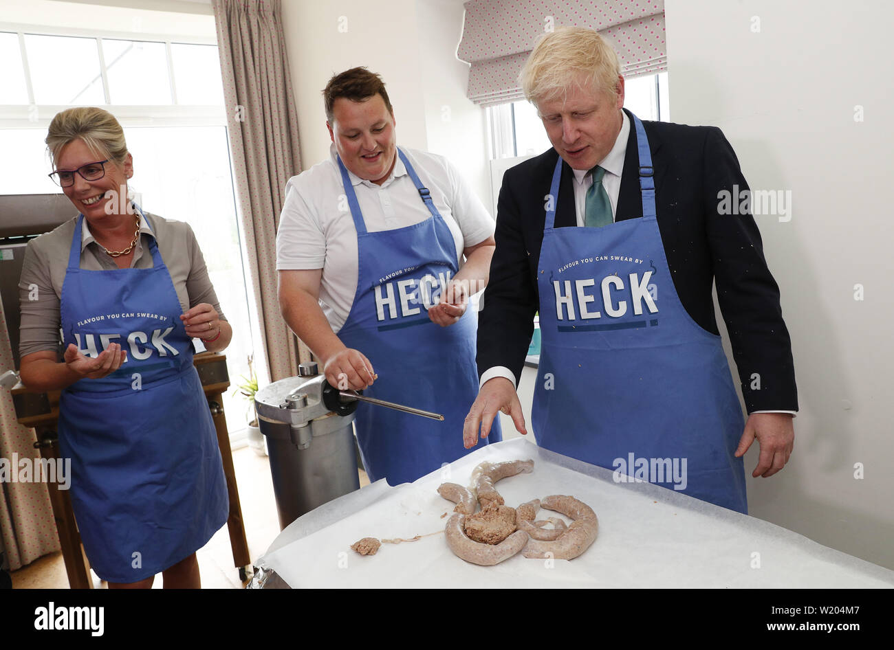 Conservative party leadership candidate Boris Johnson makes sausages ...