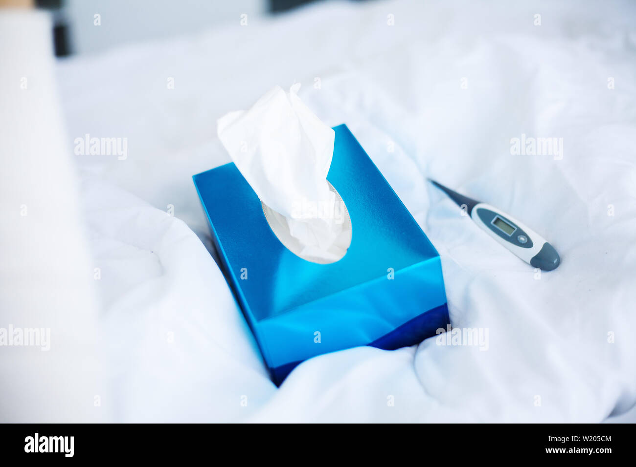Facial Tissues Cube Box. Blue pack tissues on the bed Stock Photo - Alamy