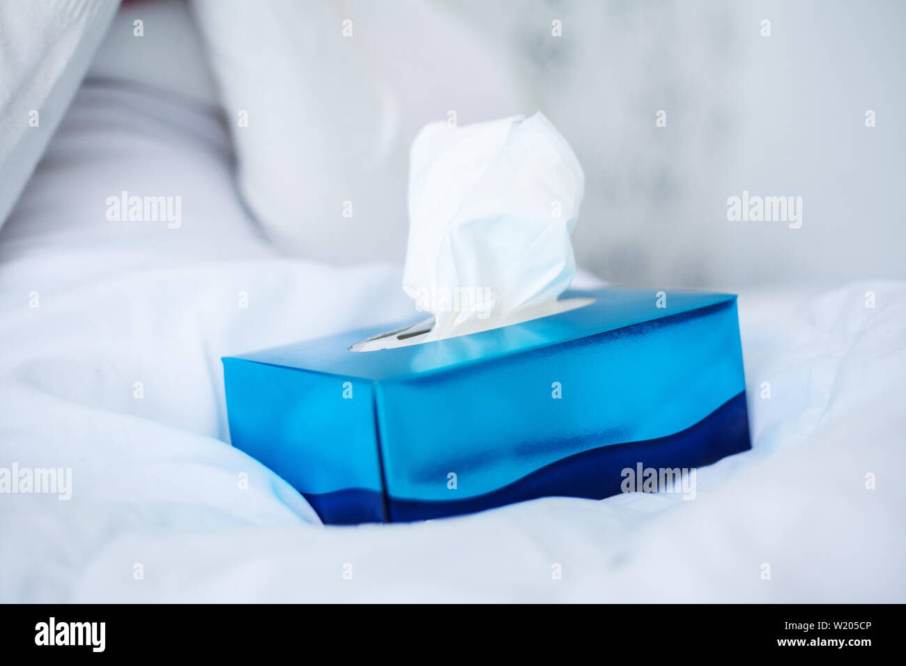 Facial Tissues Cube Box. Blue pack tissues on the bed Stock Photo - Alamy