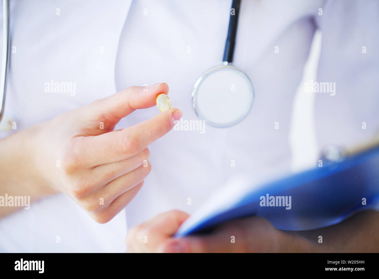 Medicine herb. Herbal pills in hand, palm, fingers with healthy medical ...