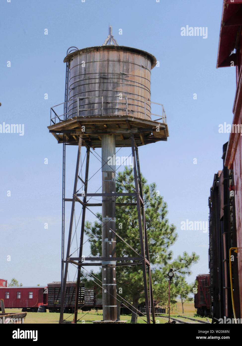 Old water tank on display by the train station of an old 1880s town in ...