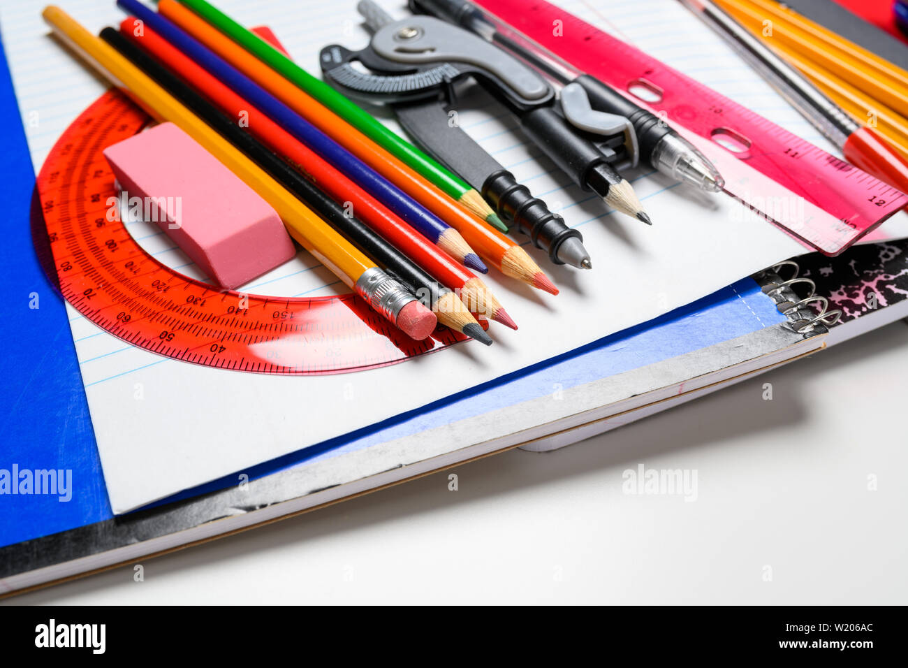 School supplies on a white background Stock Photo - Alamy
