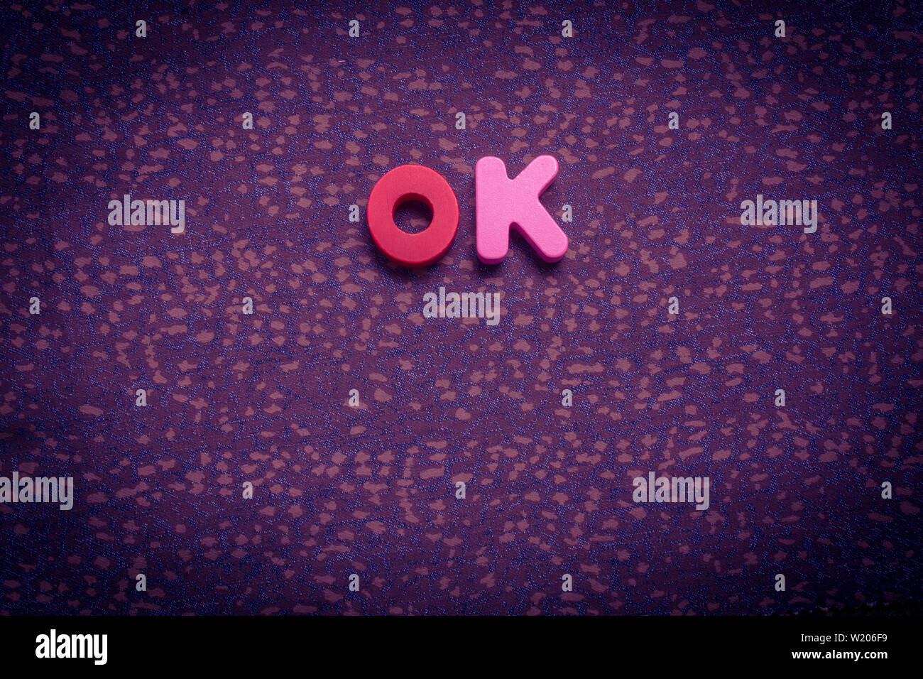 the word OK with colorful letter blocks on fabric Stock Photo - Alamy