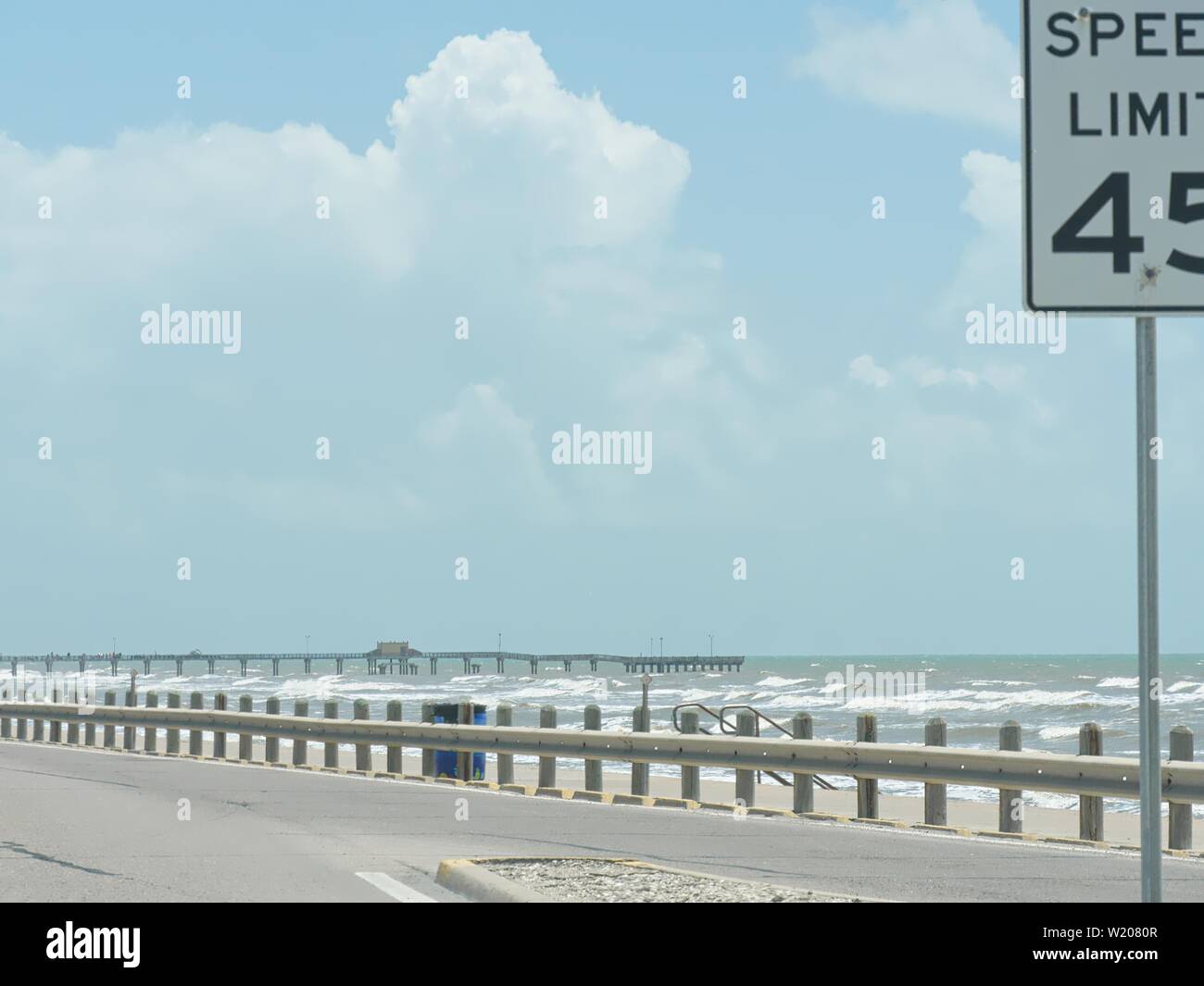 Railings along the Seawall Boulevard on a stormy day in Galveston ...