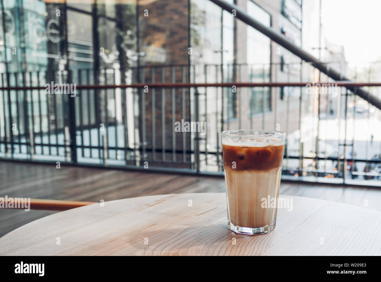 Iced coffee latte in coffee shop in shopping mall Stock Photo - Alamy