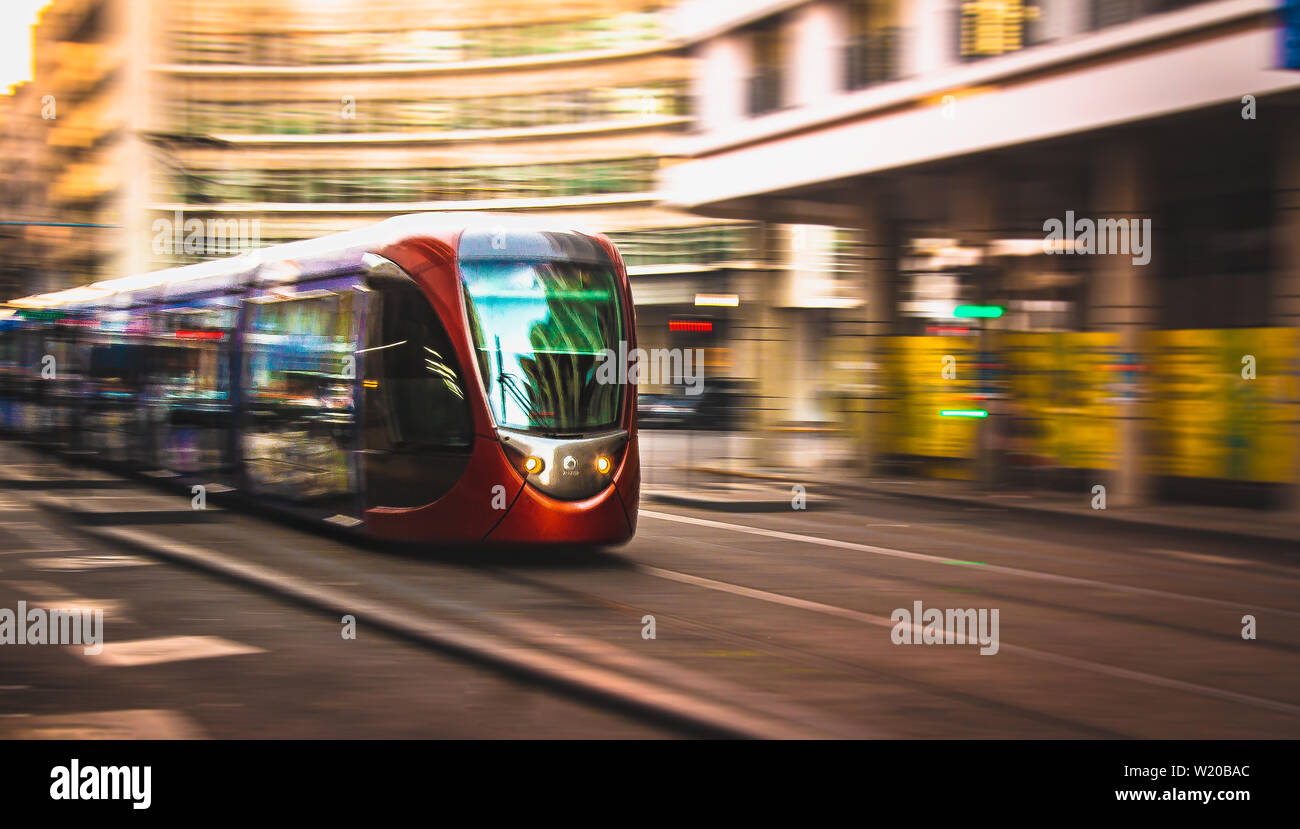 tramway tram train bike car taxi cross panning style Stock Photo - Alamy
