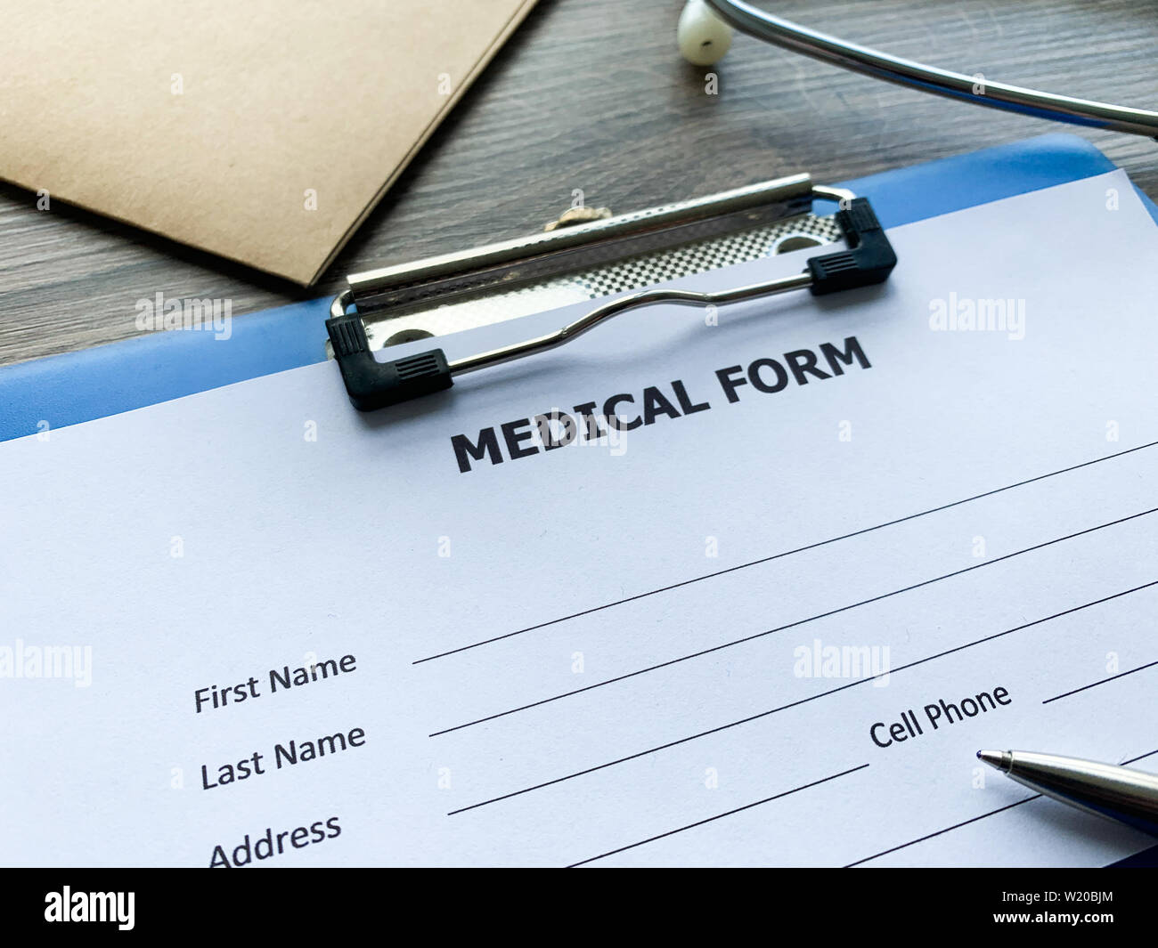 Medical form with patient data on doctor's desk Stock Photo - Alamy