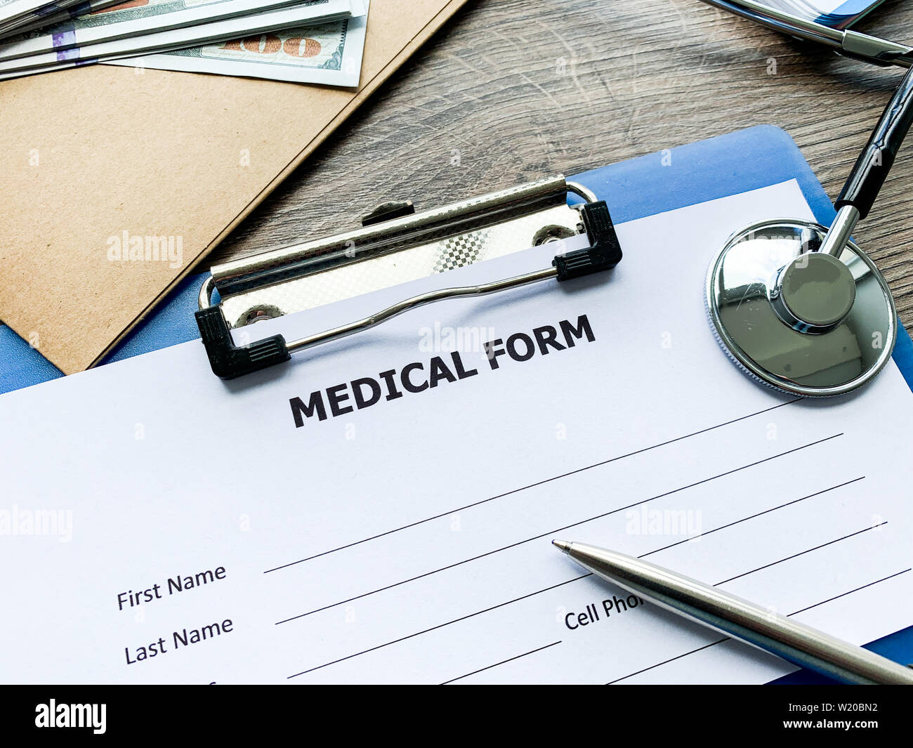 Medical form with patient data on doctor's desk Stock Photo - Alamy