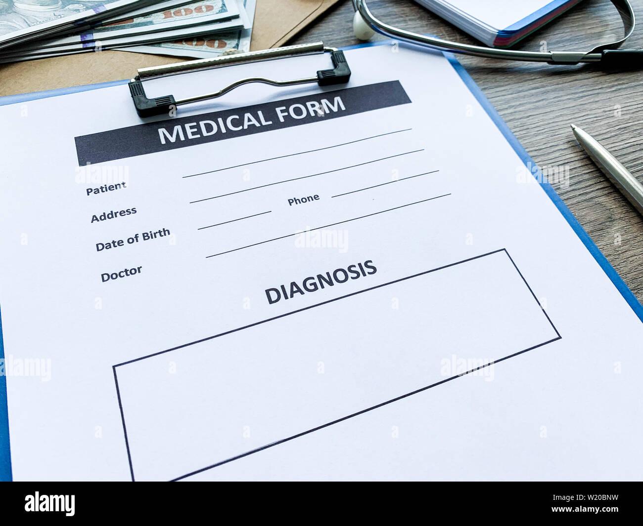 Medical form with patient data on doctor's desk Stock Photo - Alamy