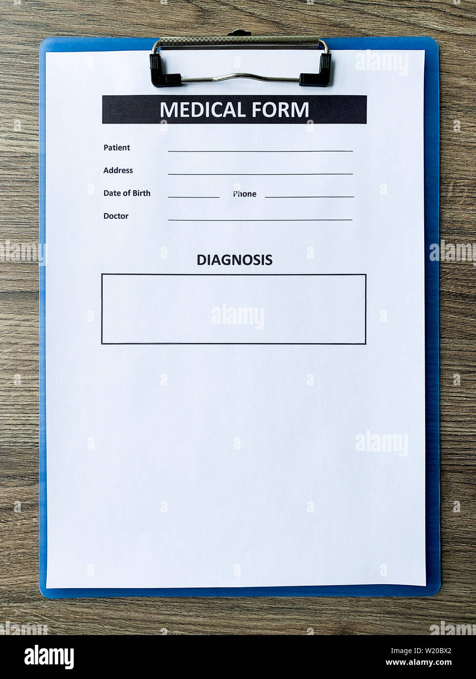 Medical form with patient data on doctor's desk Stock Photo - Alamy