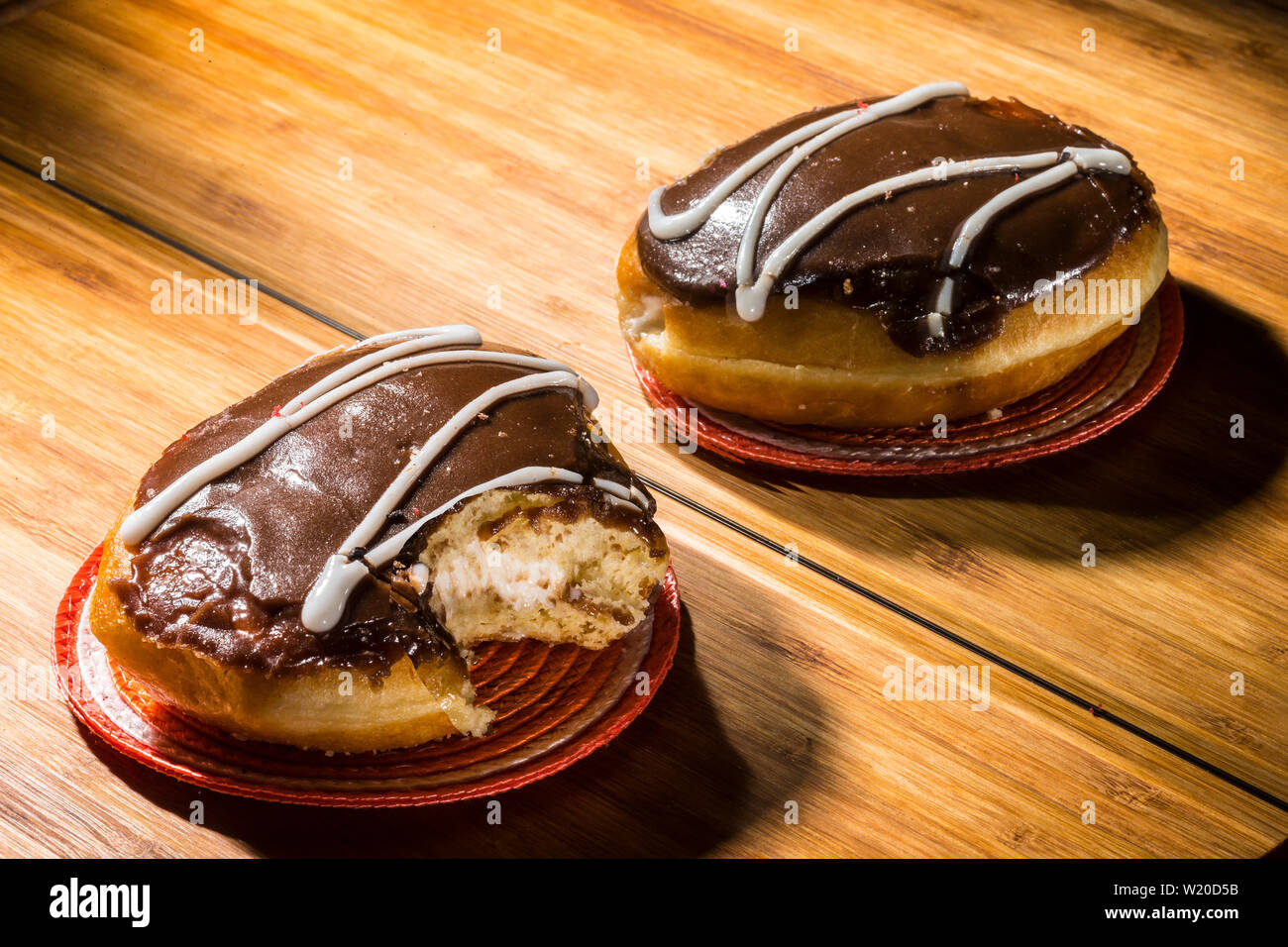 donut reflected incorrectly in mirror on wooden cutting board Stock ...