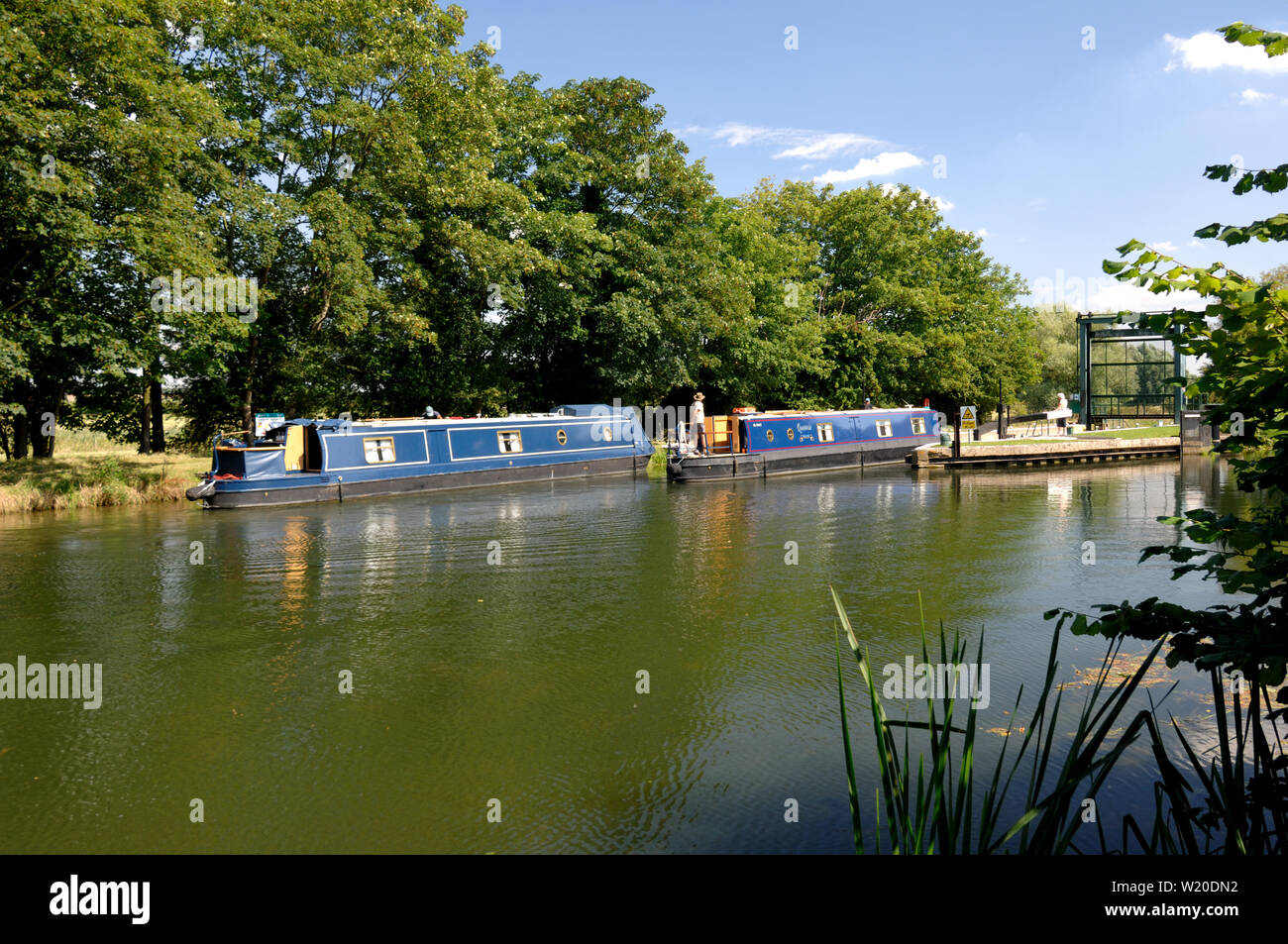 Canal boats on the River Nene, Water Newton, Cambridgeshire Stock Photo ...