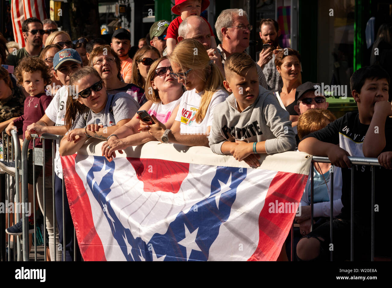 Crowd of people with the American flag lined the streets for the parade ...