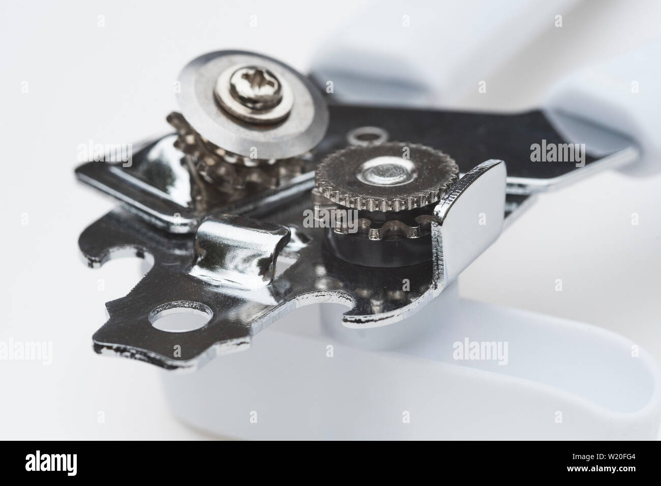A tin opener, showing an everyday use of gears connecting the drive ...