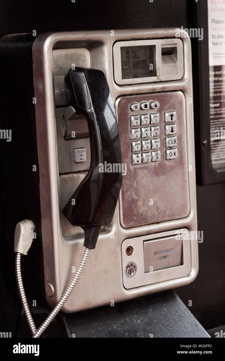 A public payphone in a classic British red telephone box Stock Photo ...