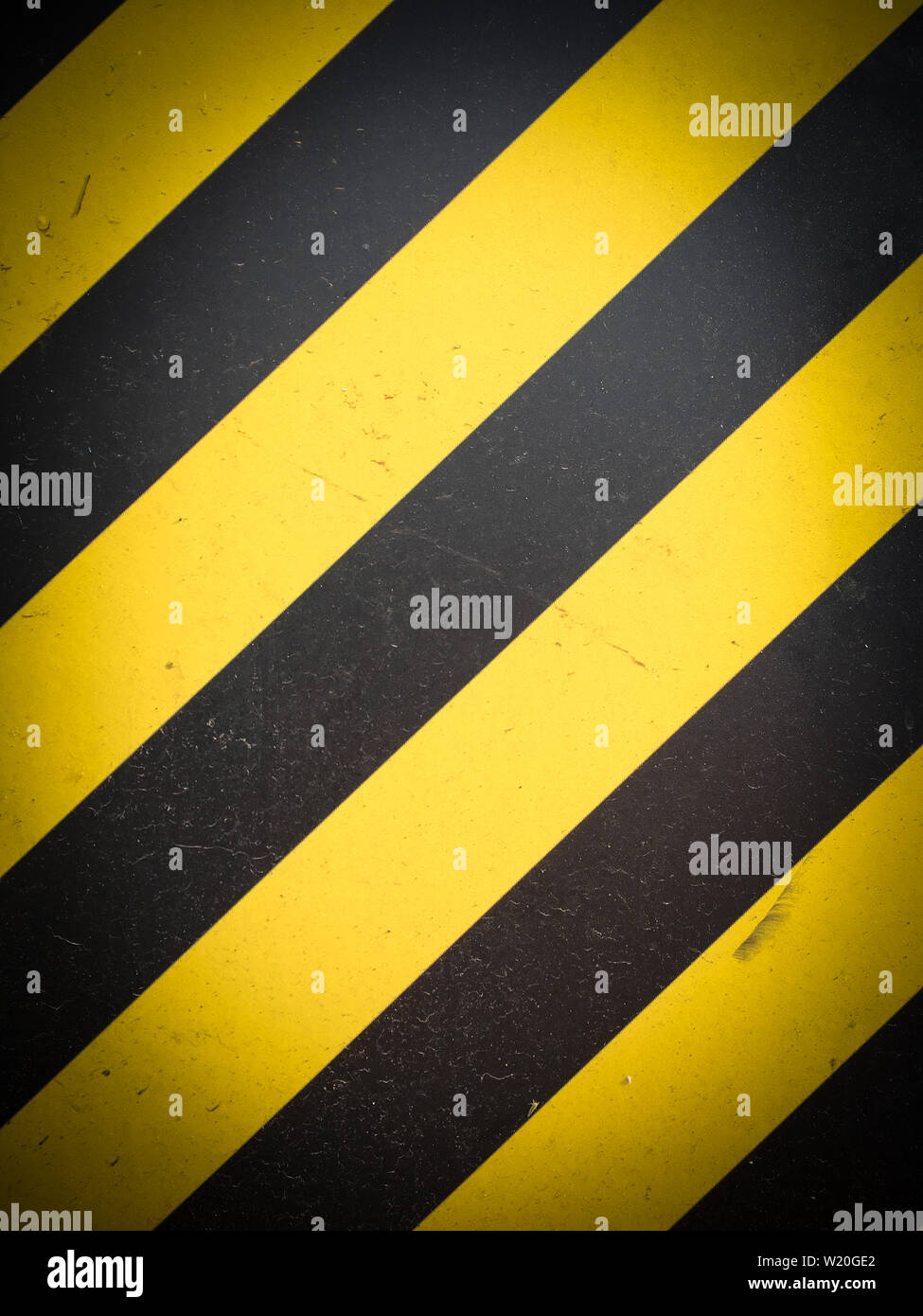 yellow black striped hazard warning background Stock Photo - Alamy