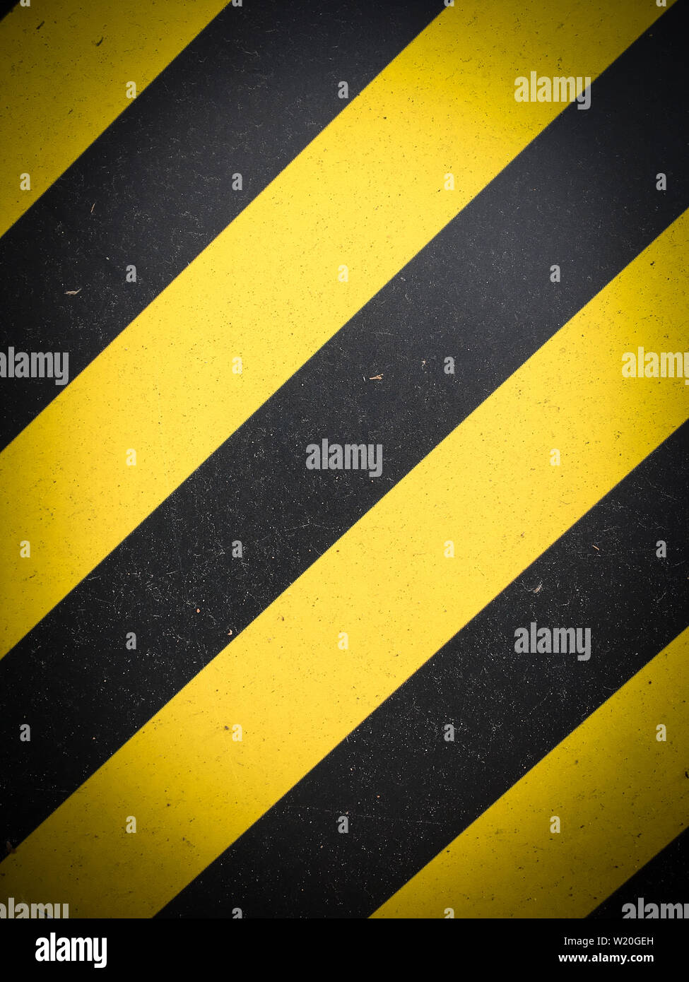 yellow black striped hazard warning background Stock Photo - Alamy