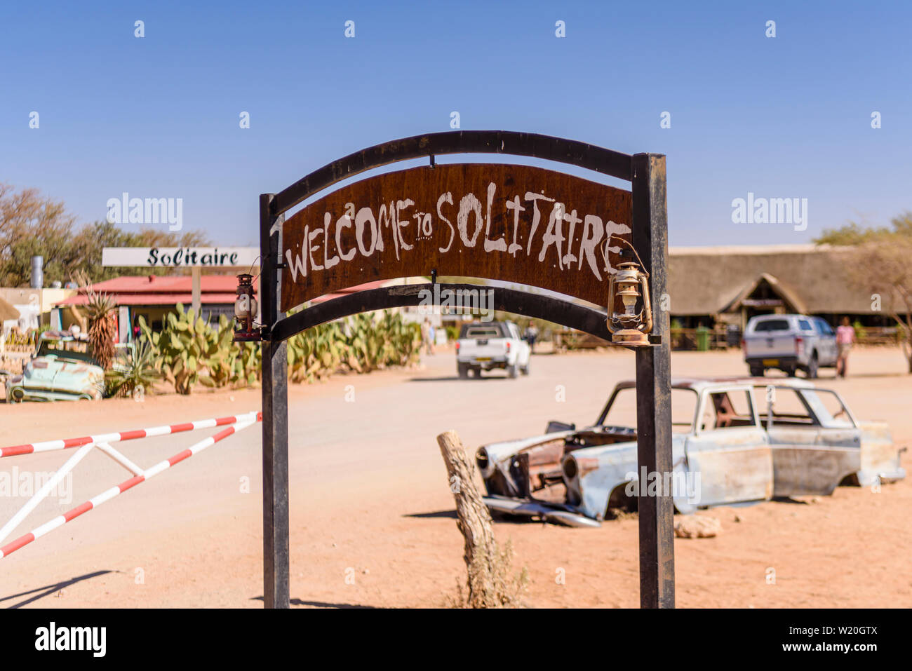 Welcome sign at Solitaire, Sesriem, Namibia with old rusty cars behind ...