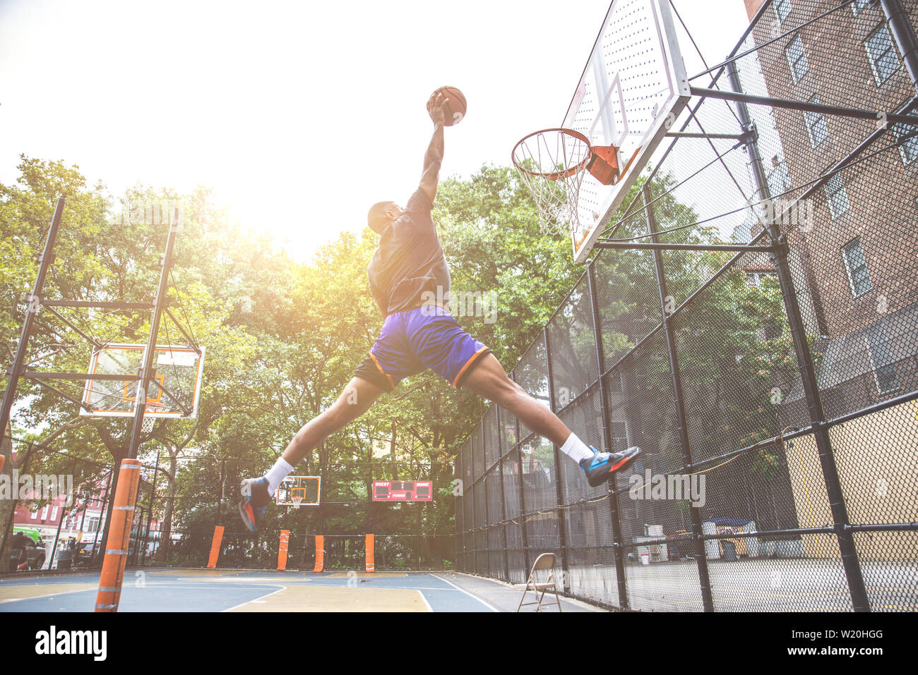 Basketball player training on a court in New york city Stock Photo - Alamy