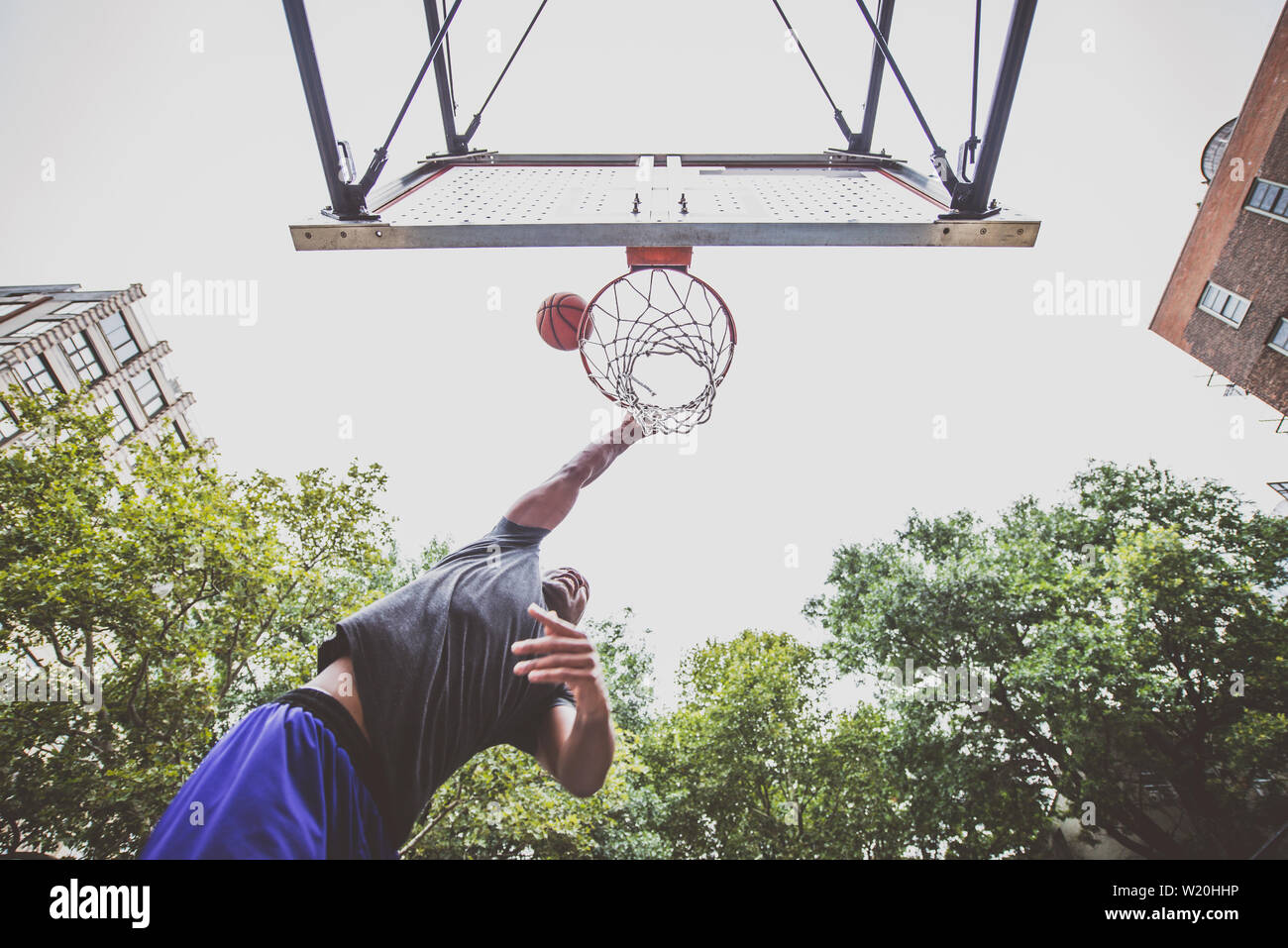 Basketball player training on a court in New york city Stock Photo - Alamy