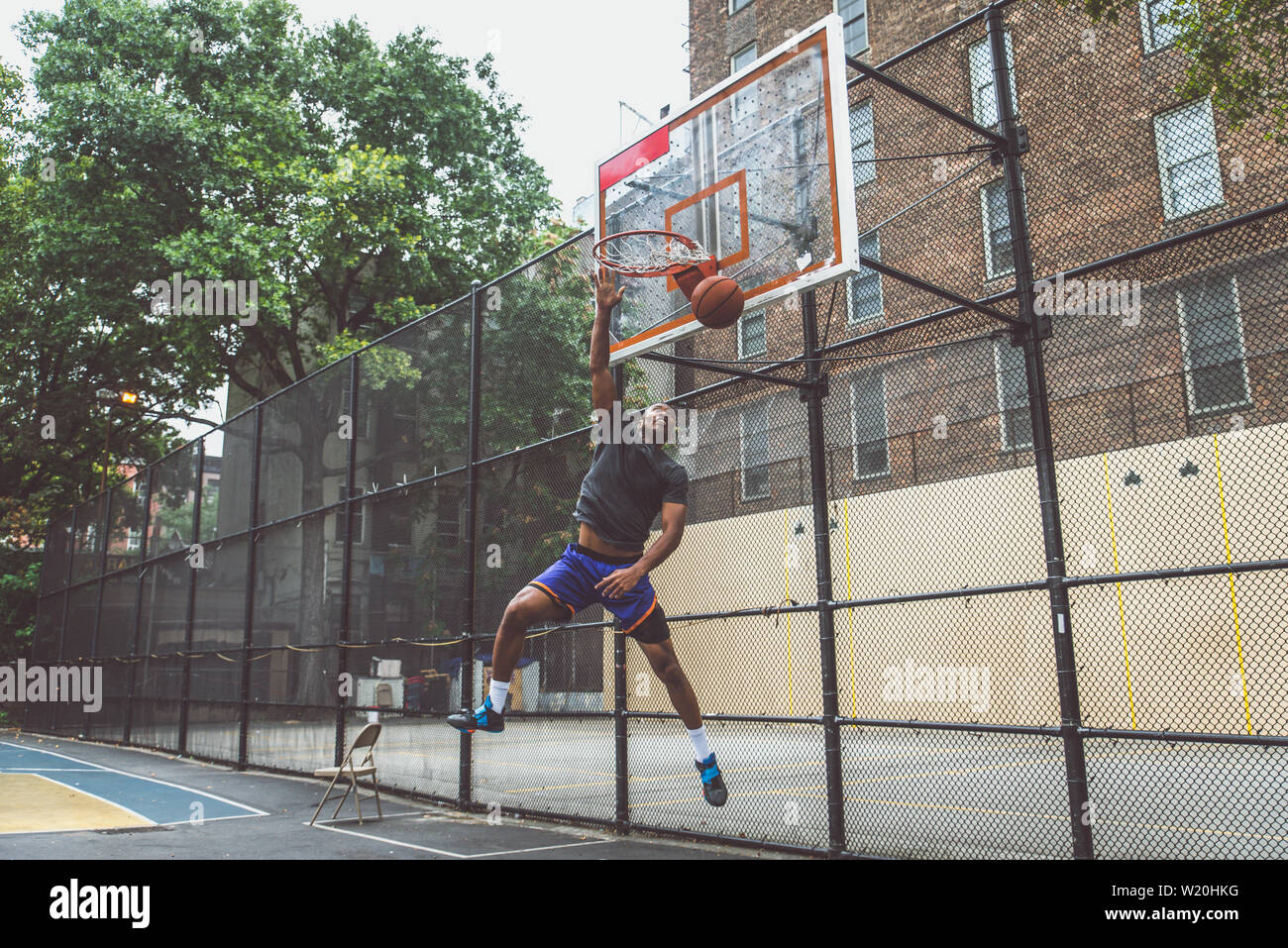 Basketball player training on a court in New york city Stock Photo - Alamy