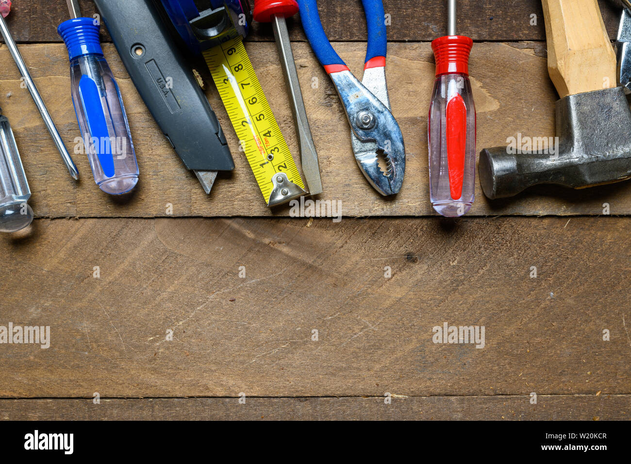 Working tools on wooden background Stock Photo - Alamy