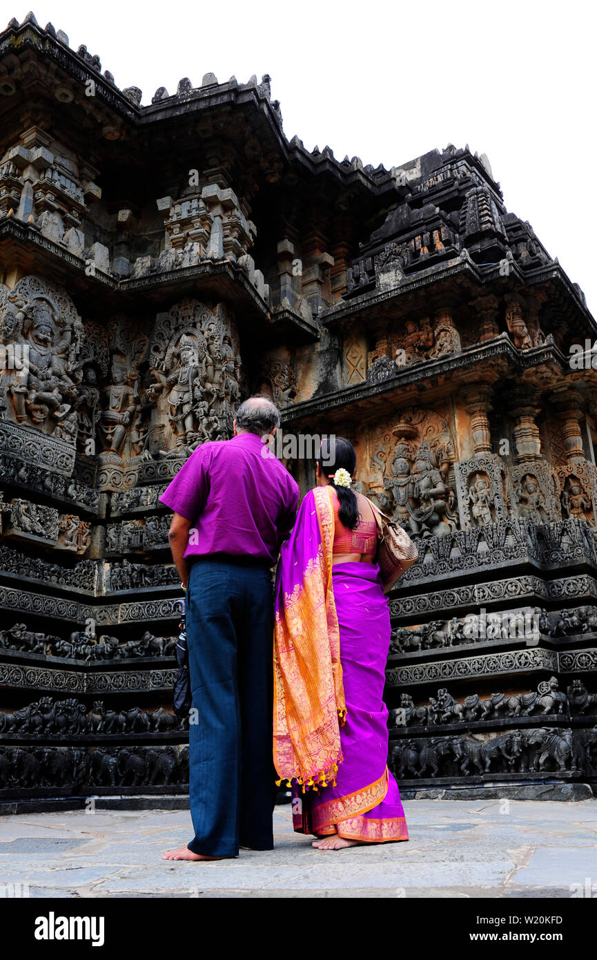 Indian couple in traditional clothes visiting Hoysaleswara Temple ...