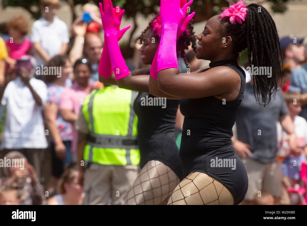 Dancers make their way along the parade route in the 4th of July parade ...