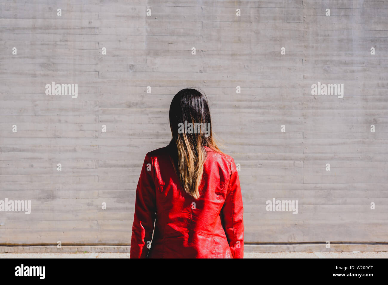 Woman on her back with a casual jacket in a depressing and sad attitude ...