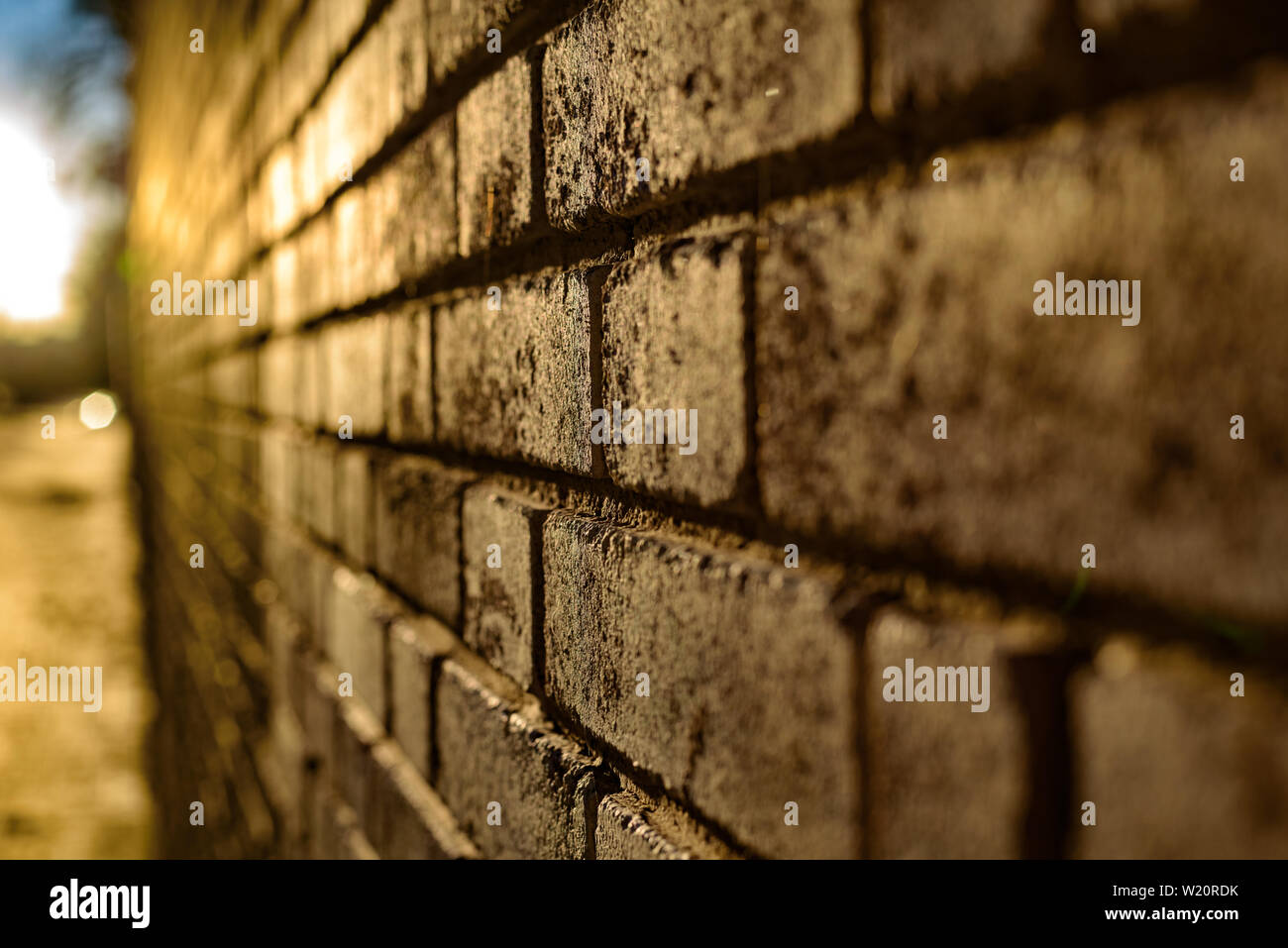 Brick wall background at sunset with sun rays, stone texture Stock ...
