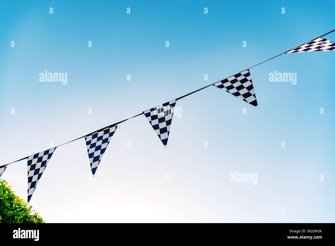 Decoration pennants with black and white squares like the flag of a car ...