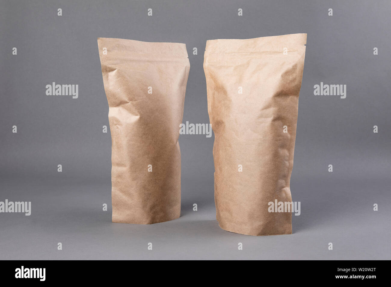 Mockup craft paper pouch bag over gray Stock Photo - Alamy